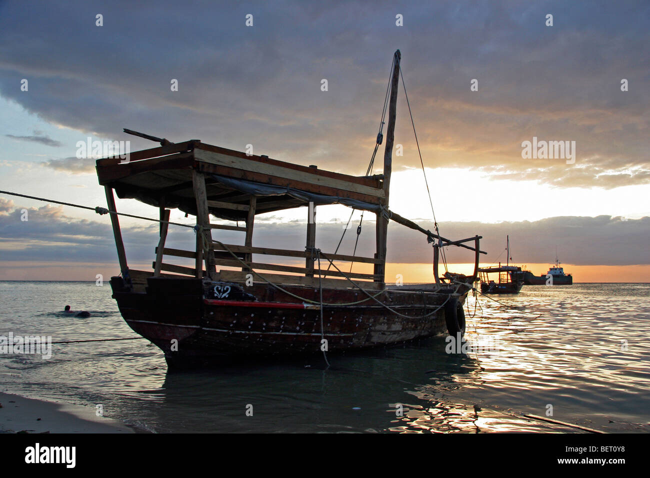 Boats on the Indian Ocean at sunset in the harbour of Stone Town ...