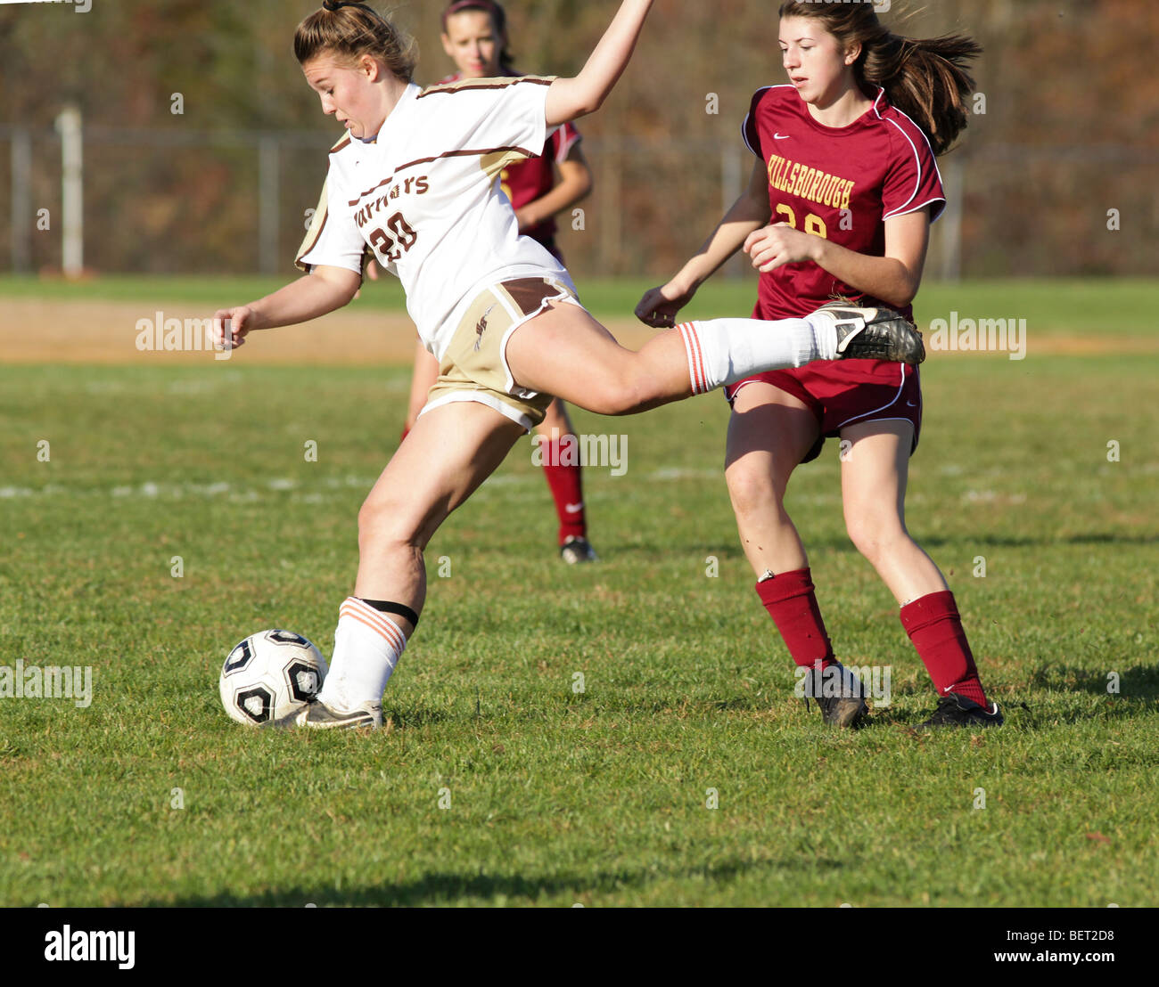Teenage girls playing high school soccer football Stock Photo - Alamy