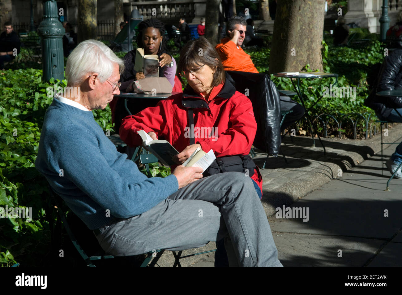 People reading books in the sun in Bryant Park in New York on Monday ...