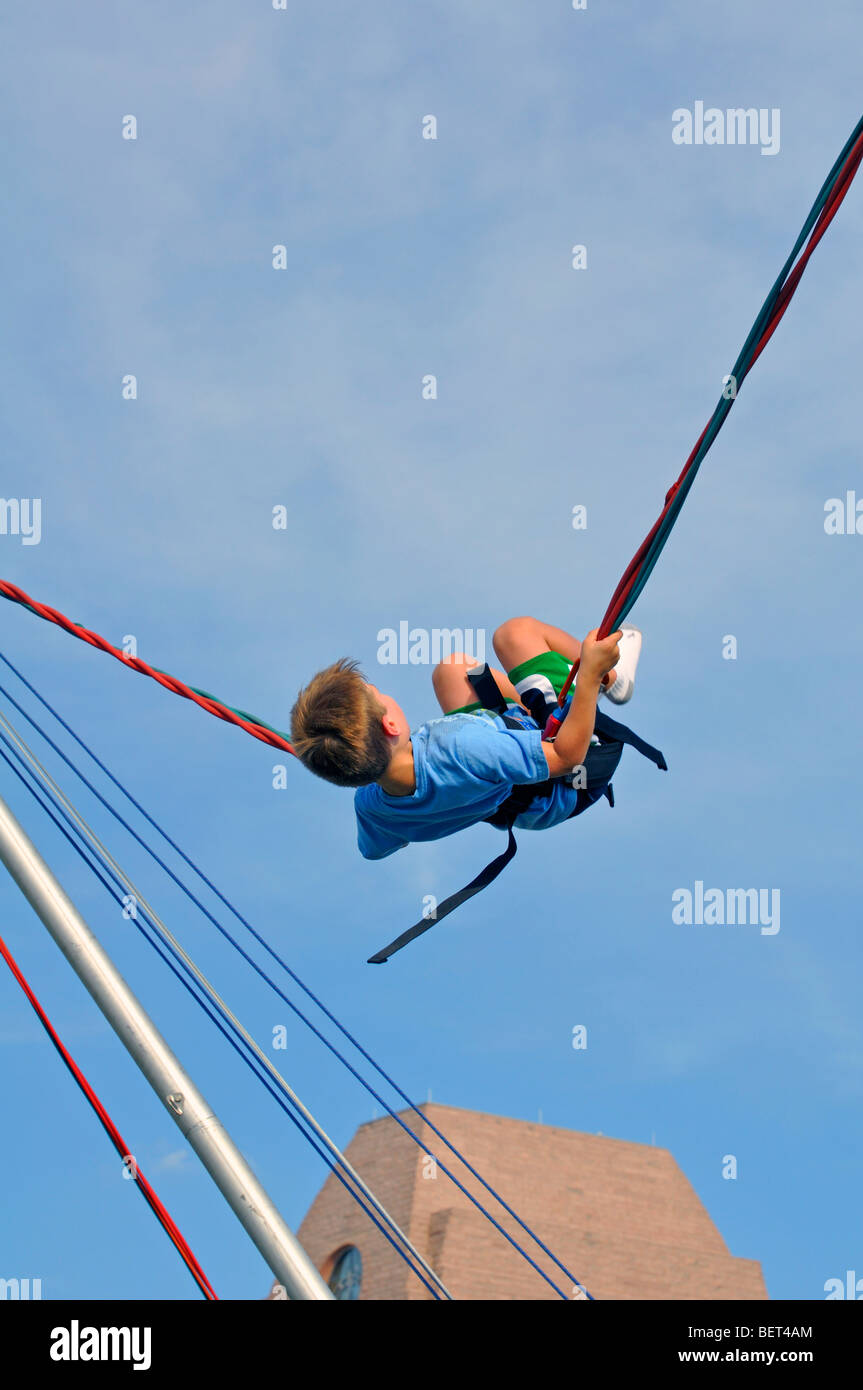 Boy enjoying European bungee Stock Photo - Alamy