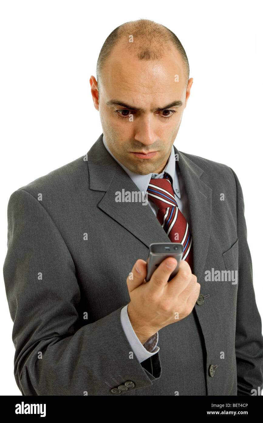 young business man looking worried to his phone, isolated Stock Photo ...