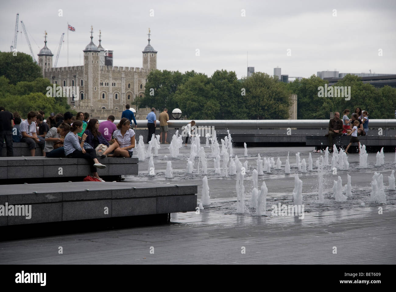 Water feature at Tower Bridge with the Tower of London in the ...
