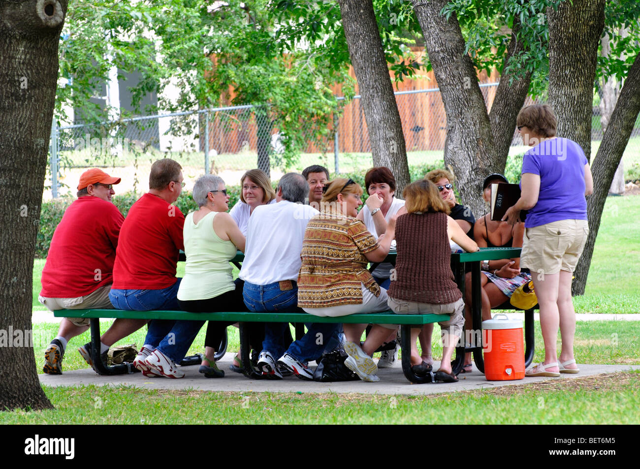 Informal business meeting in park Stock Photo - Alamy