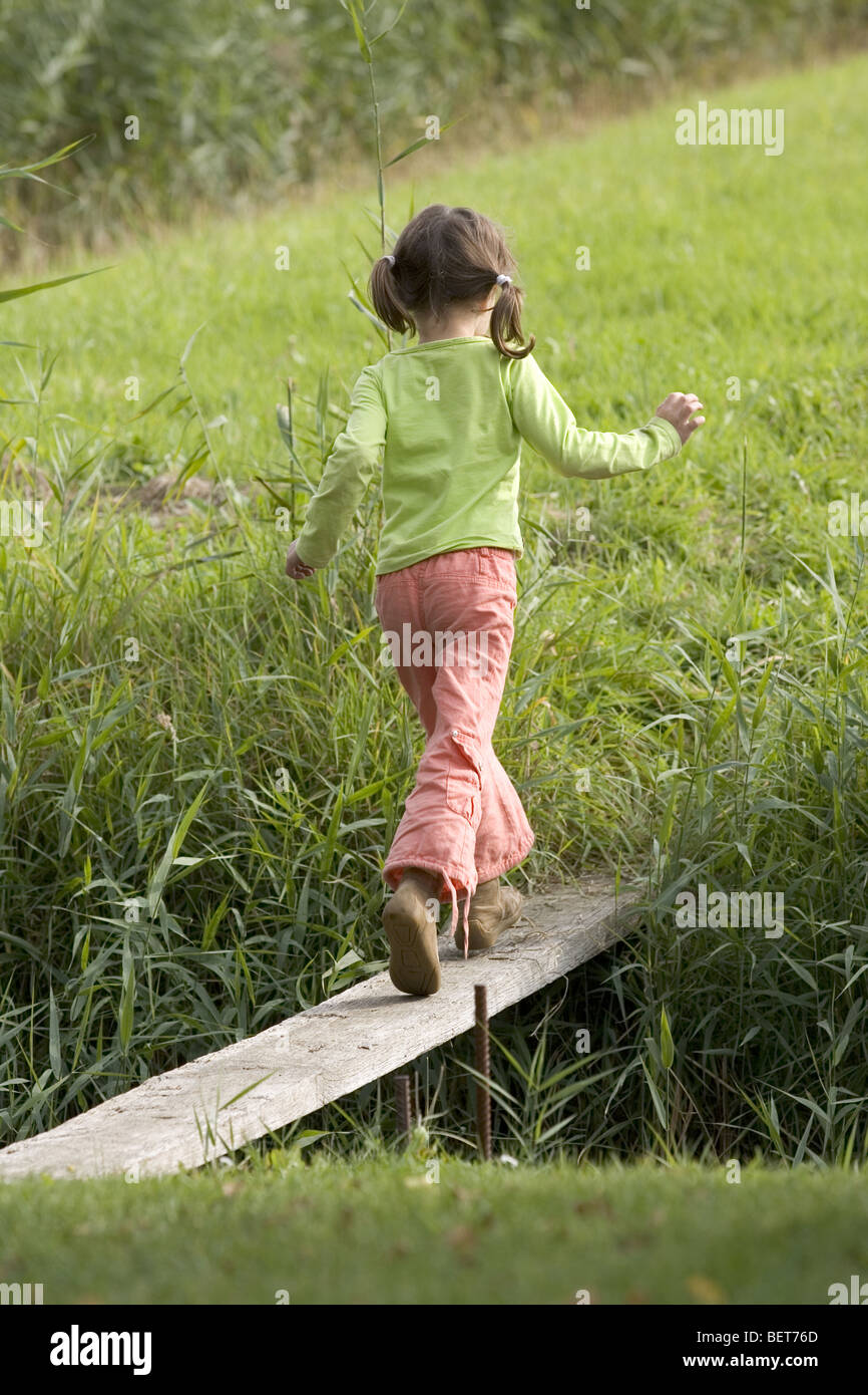 Child running on path rear view hi-res stock photography and images - Alamy