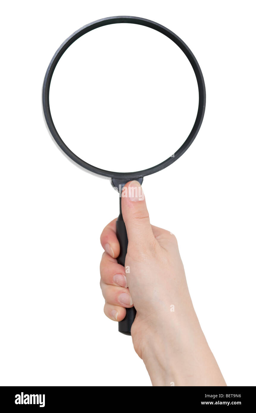 The female hand holds the big magnifier isolated on a white background ...