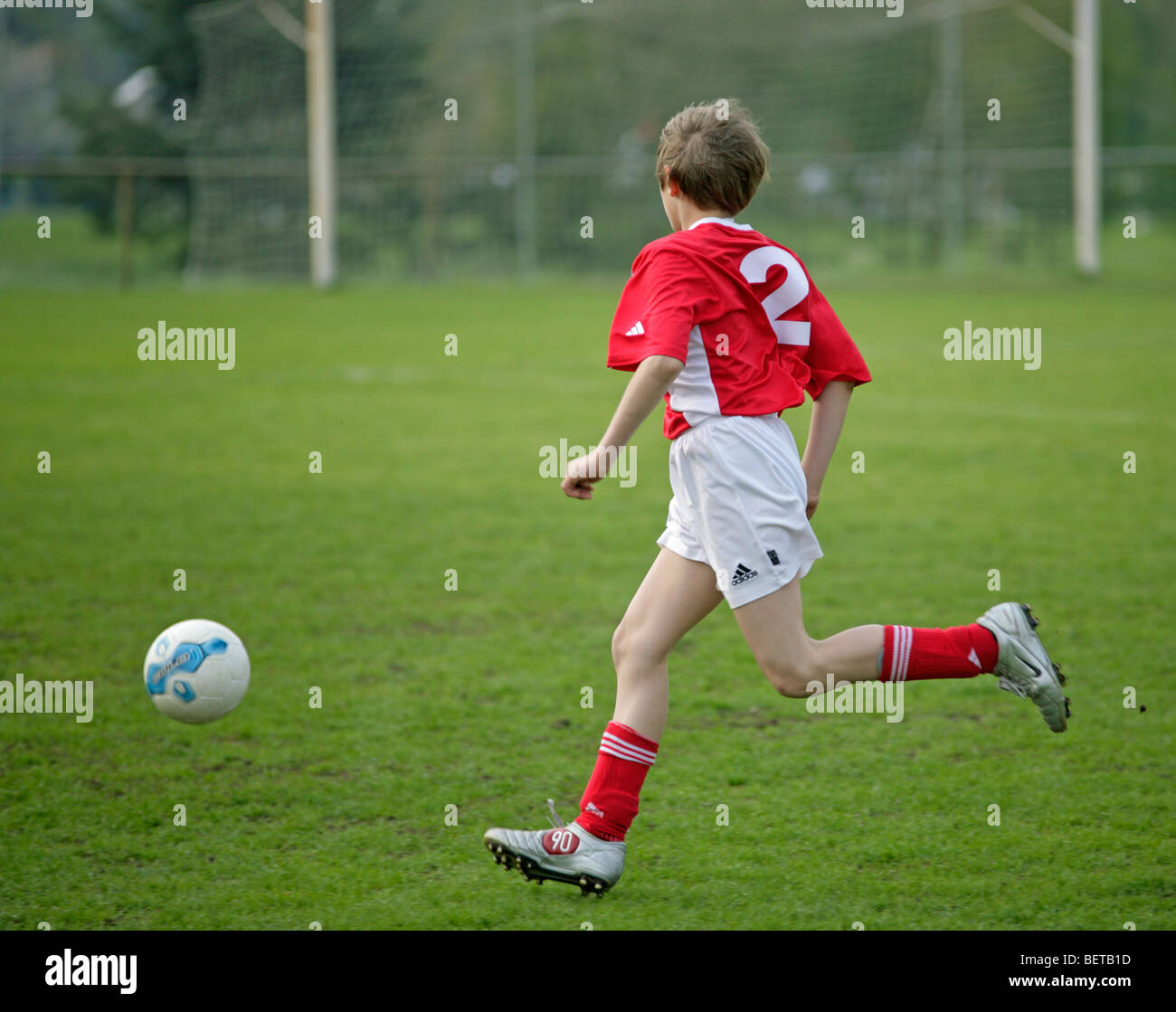young boy playing football Stock Photo - Alamy young boy playing football Stock Photo - Alamy