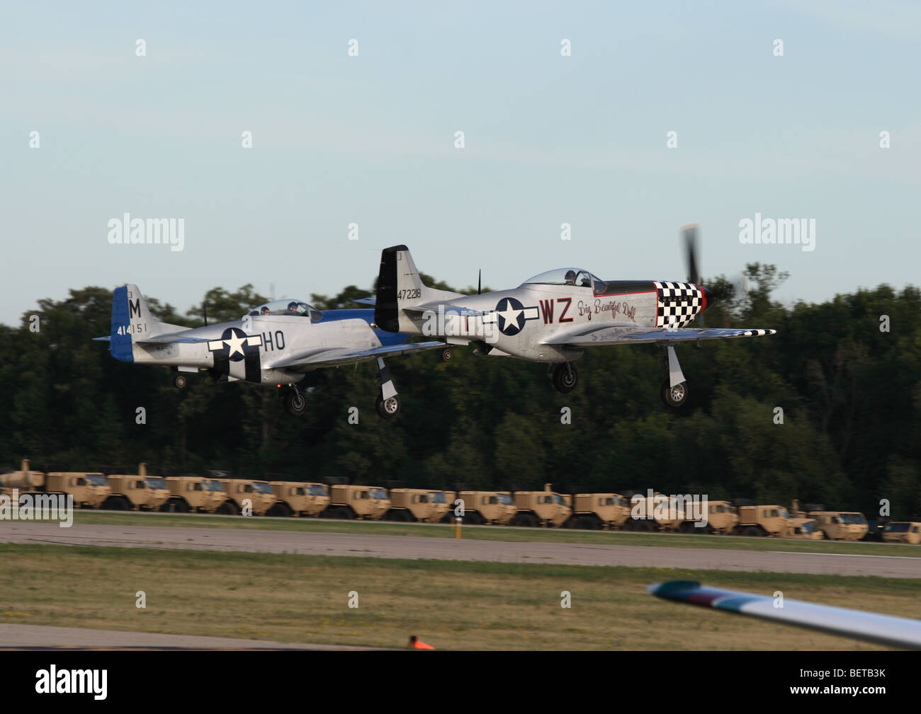 A Pair of P-51 Mustangs take off in formation from EAA Airventure 2009 ...
