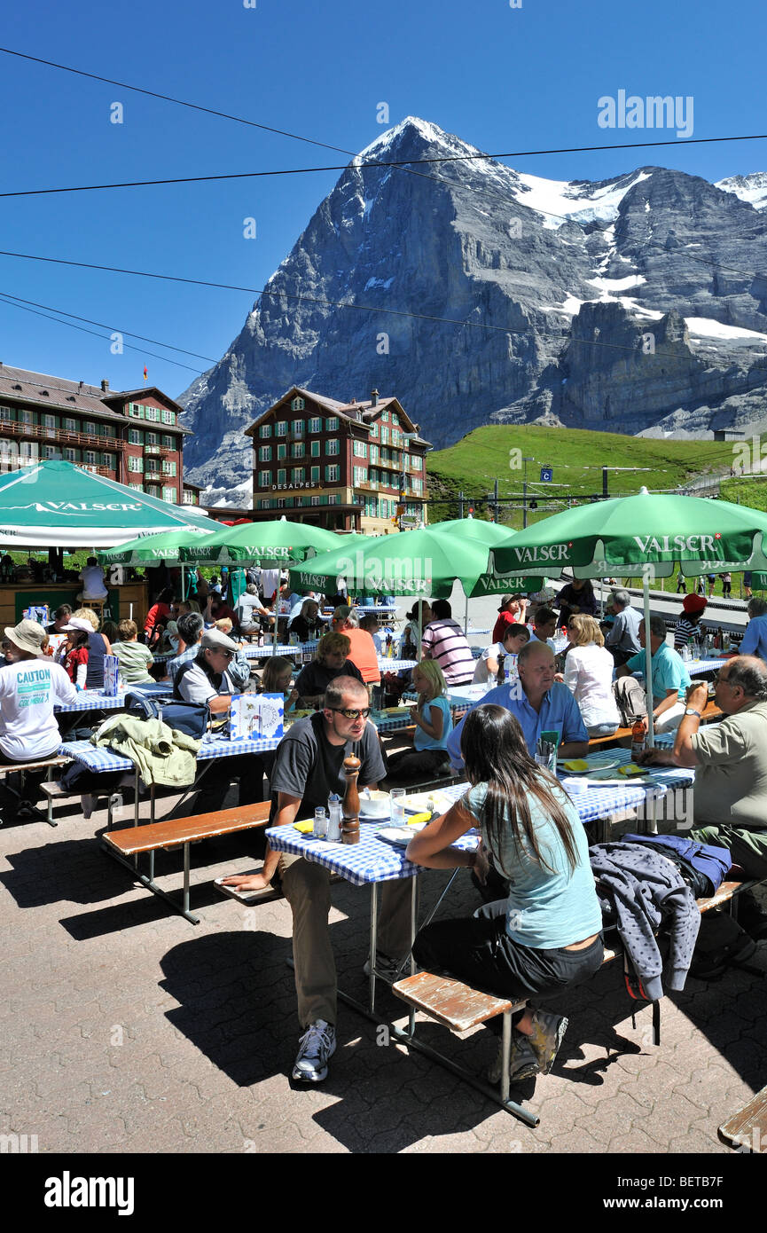 Tourists and hotels at the Kleine Scheidegg, mountain pass with view on ...