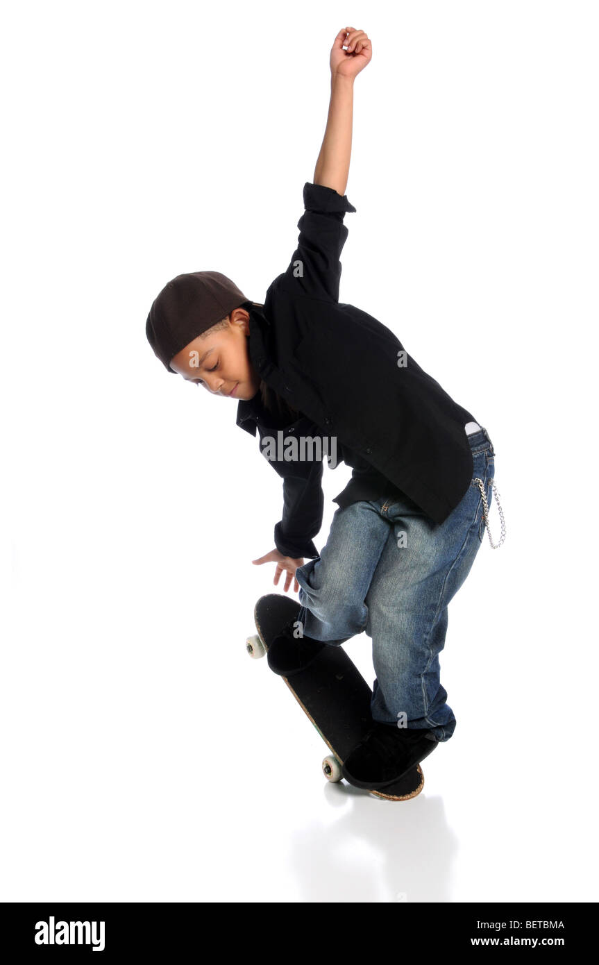 Young African American skateboarder performing trick isolated over ...
