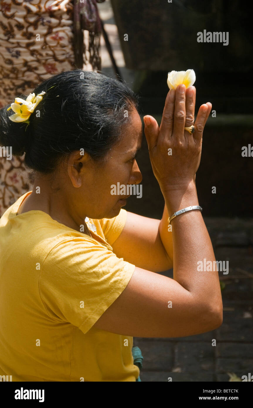 praying at the holy water temple of Tirta Empul in Bali Indonesia Stock ...