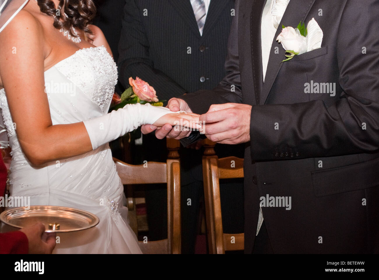 bridegroom set up the wedding ring his wife Stock Photo - Alamy