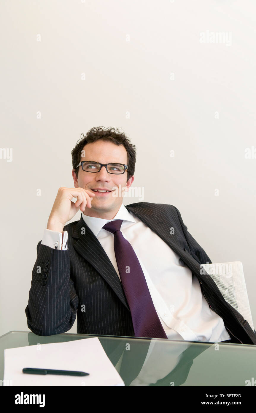 A young business man thinking Stock Photo - Alamy