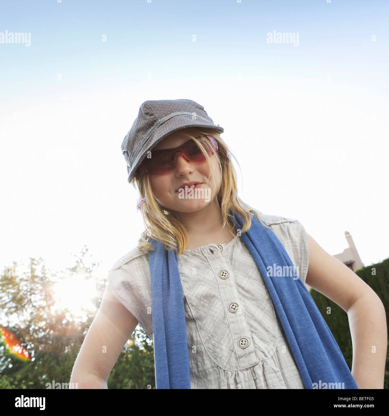 Young girl wearing sunglasses smiling Stock Photo - Alamy