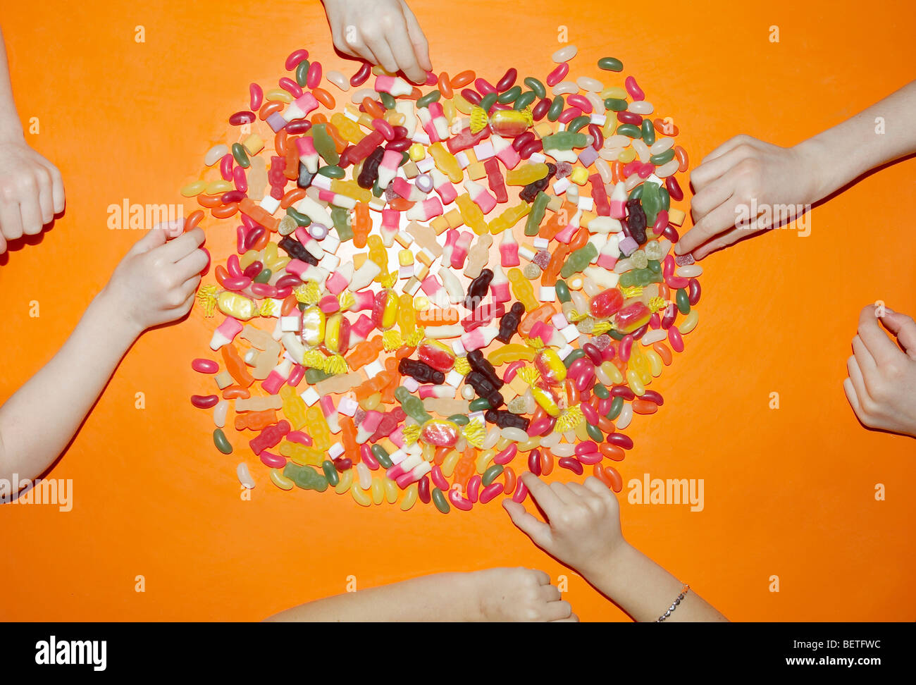 children's hands choosing sweets Stock Photo - Alamy