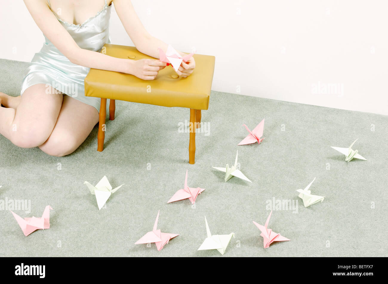woman making origami swans Stock Photo - Alamy