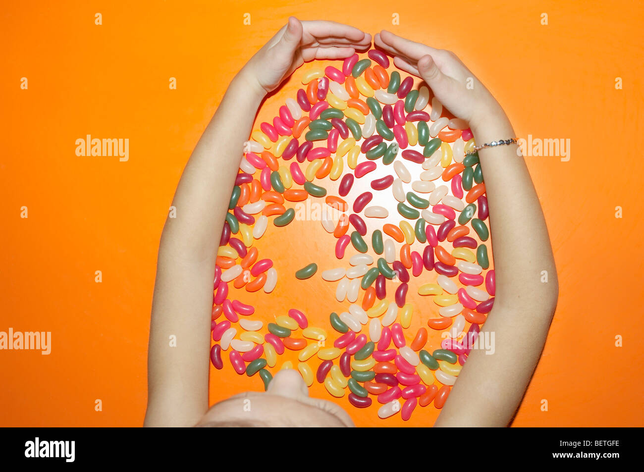 child grabbing sweets Stock Photo - Alamy