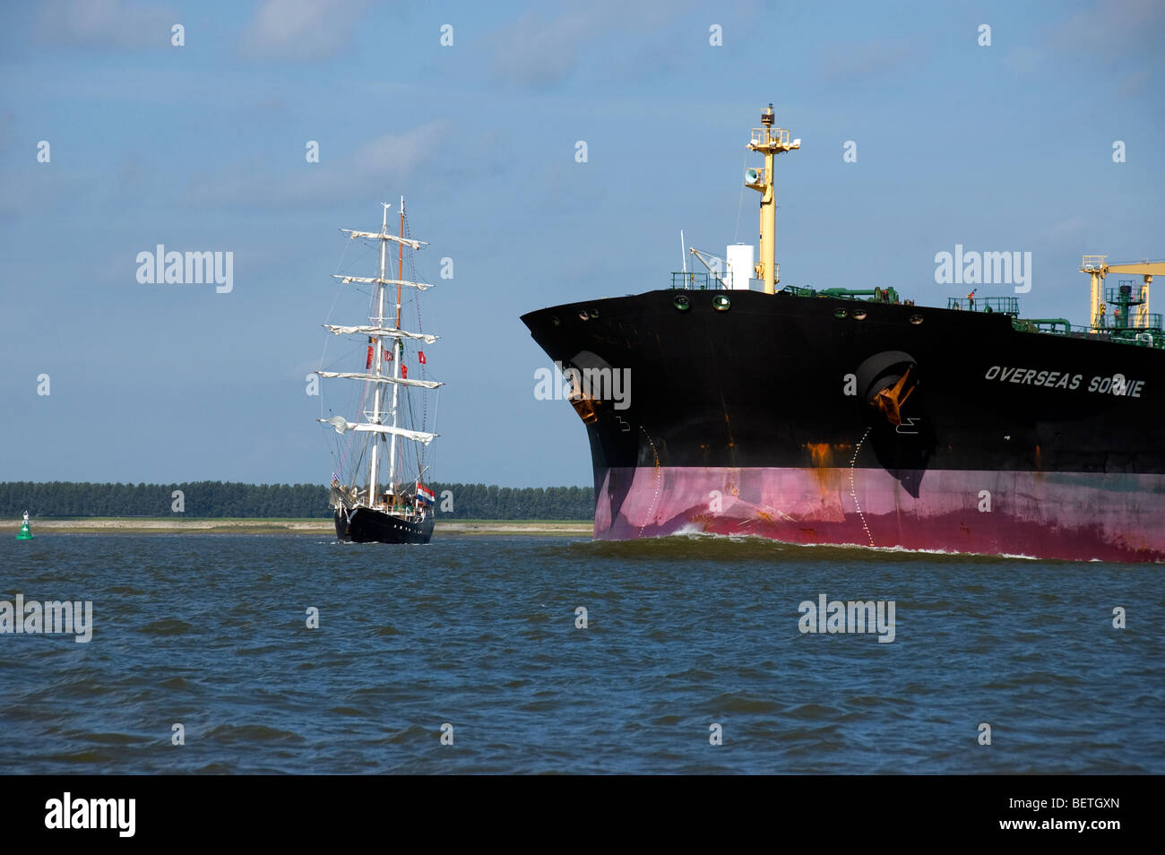 Sailing ship and oil tanker on the river Scheldt during the Tall Ship's ...
