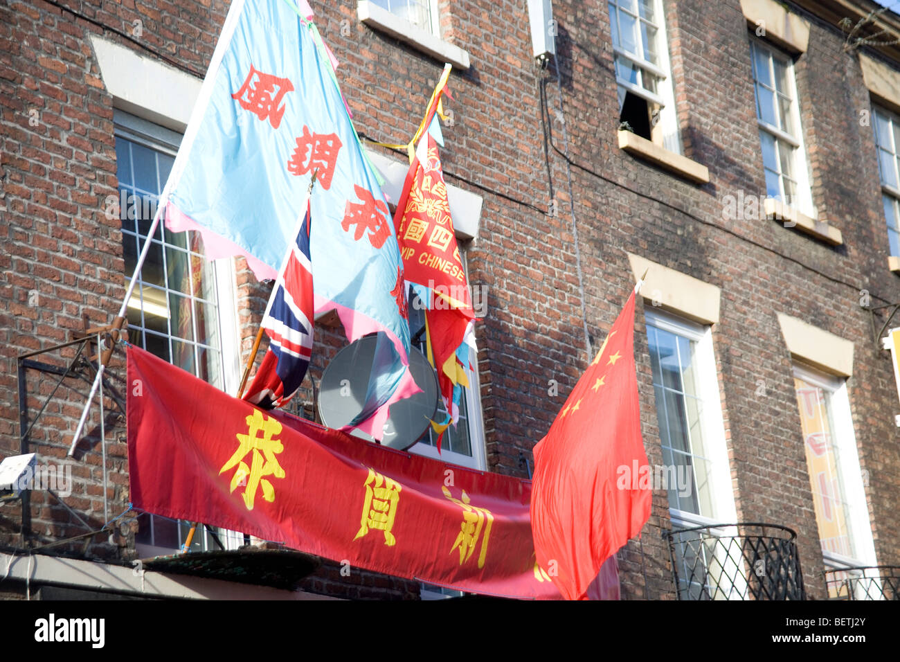 Chinese flags in Hardy Street in the Chinese Quarter of Liverpool Stock ...