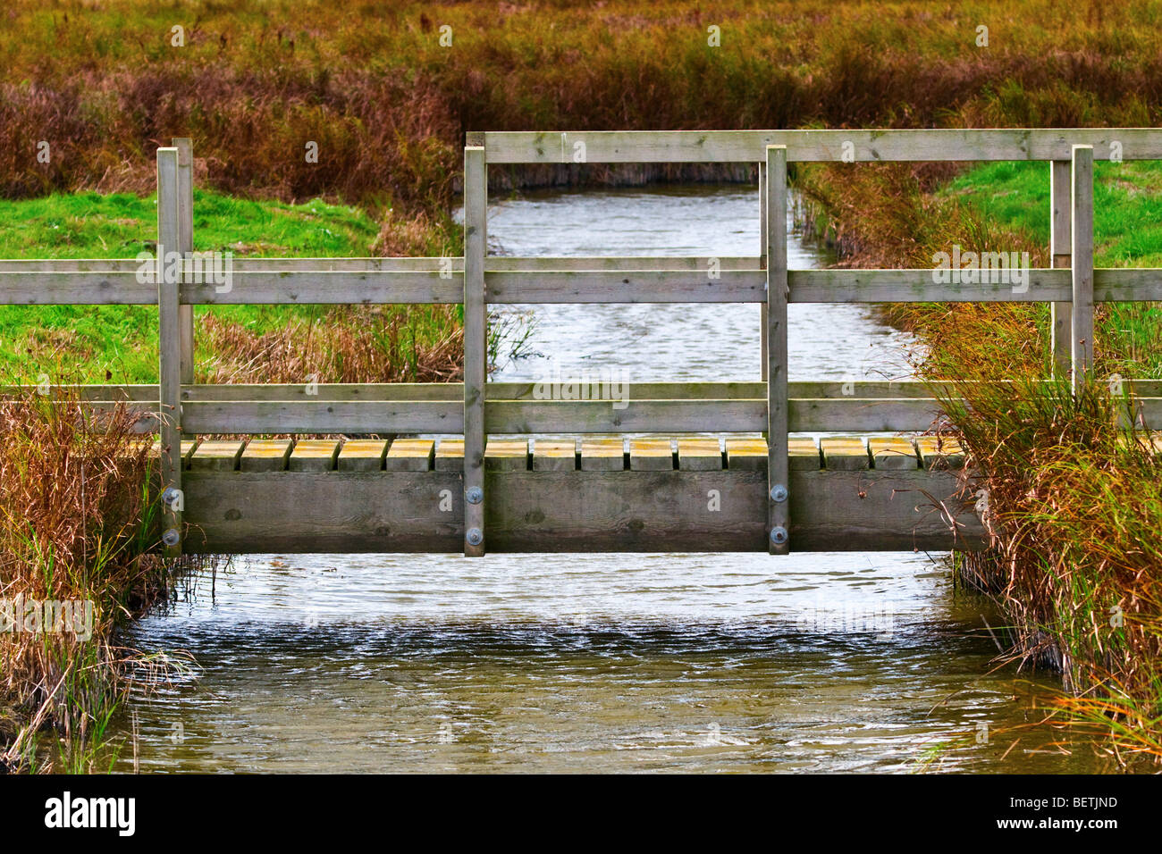 A hand built wooden bridge spanning a ditch Stock Photo - Alamy