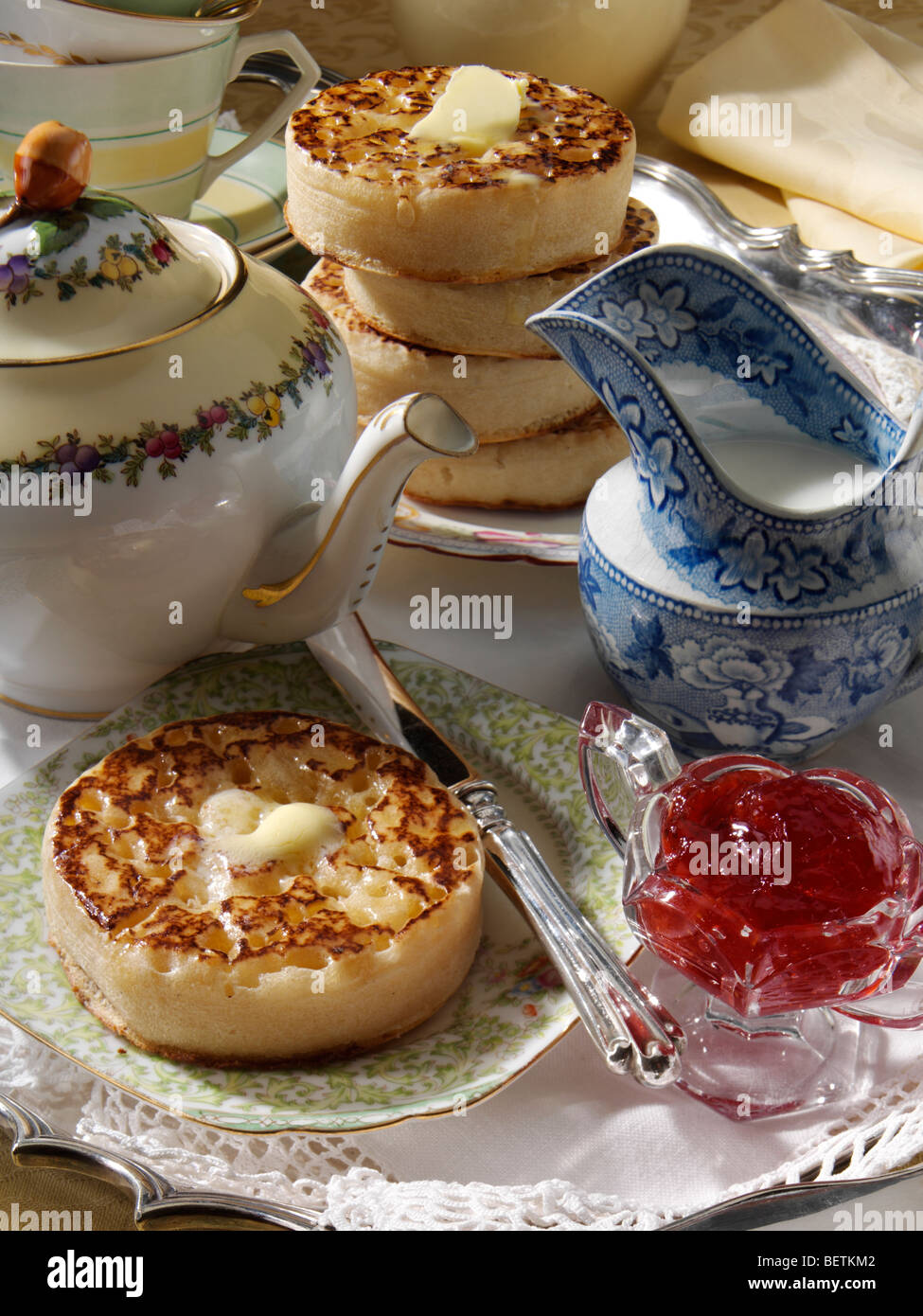 Buttered crumpets in an afternoon tea setting Stock Photo - Alamy