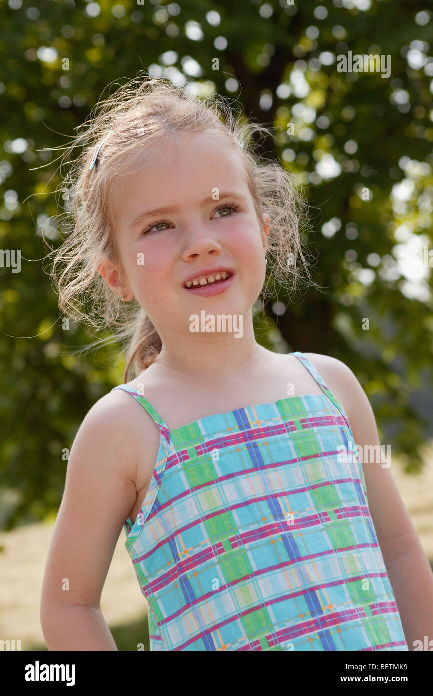 young girl outdoors looking thoughtful Stock Photo - Alamy