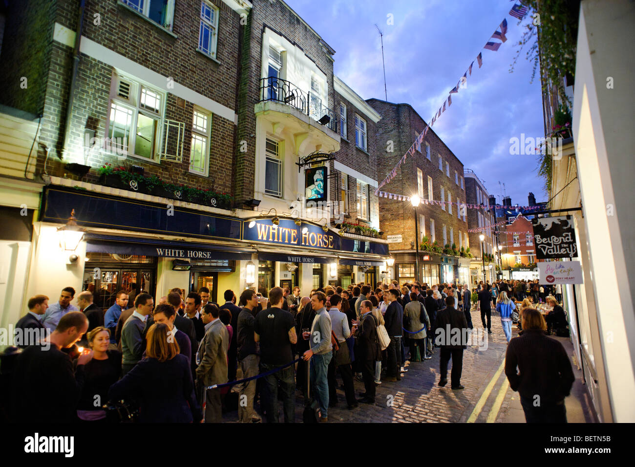 People drinking outside the White Horse pub. Soho. London. Britain. UK ...
