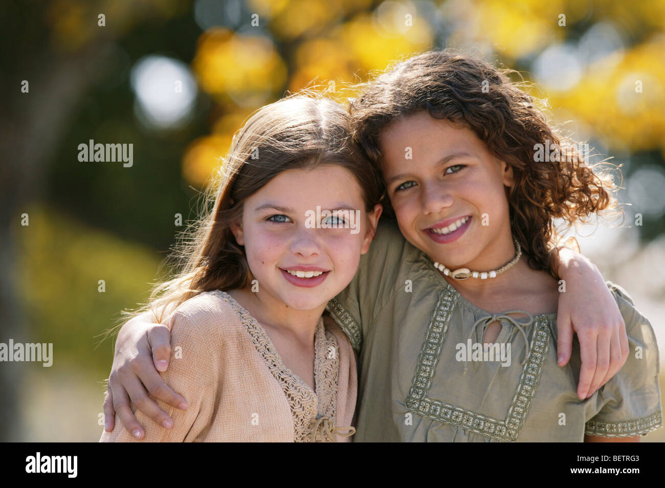 portrait of two young girls looking at the camera Stock Photo - Alamy