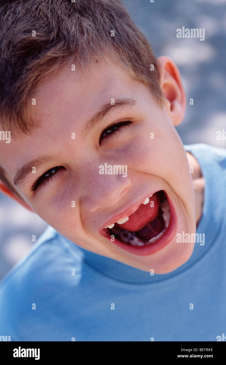 head shot of a young boy showing his gap in his teeth Stock Photo - Alamy