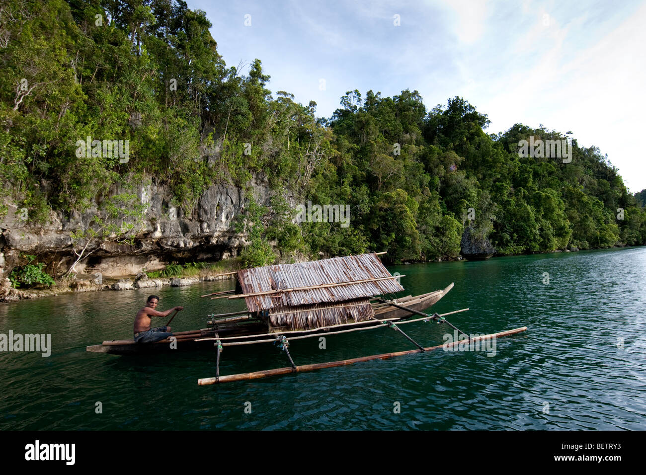 Man paddling outrigger canoe hi-res stock photography and images - Alamy