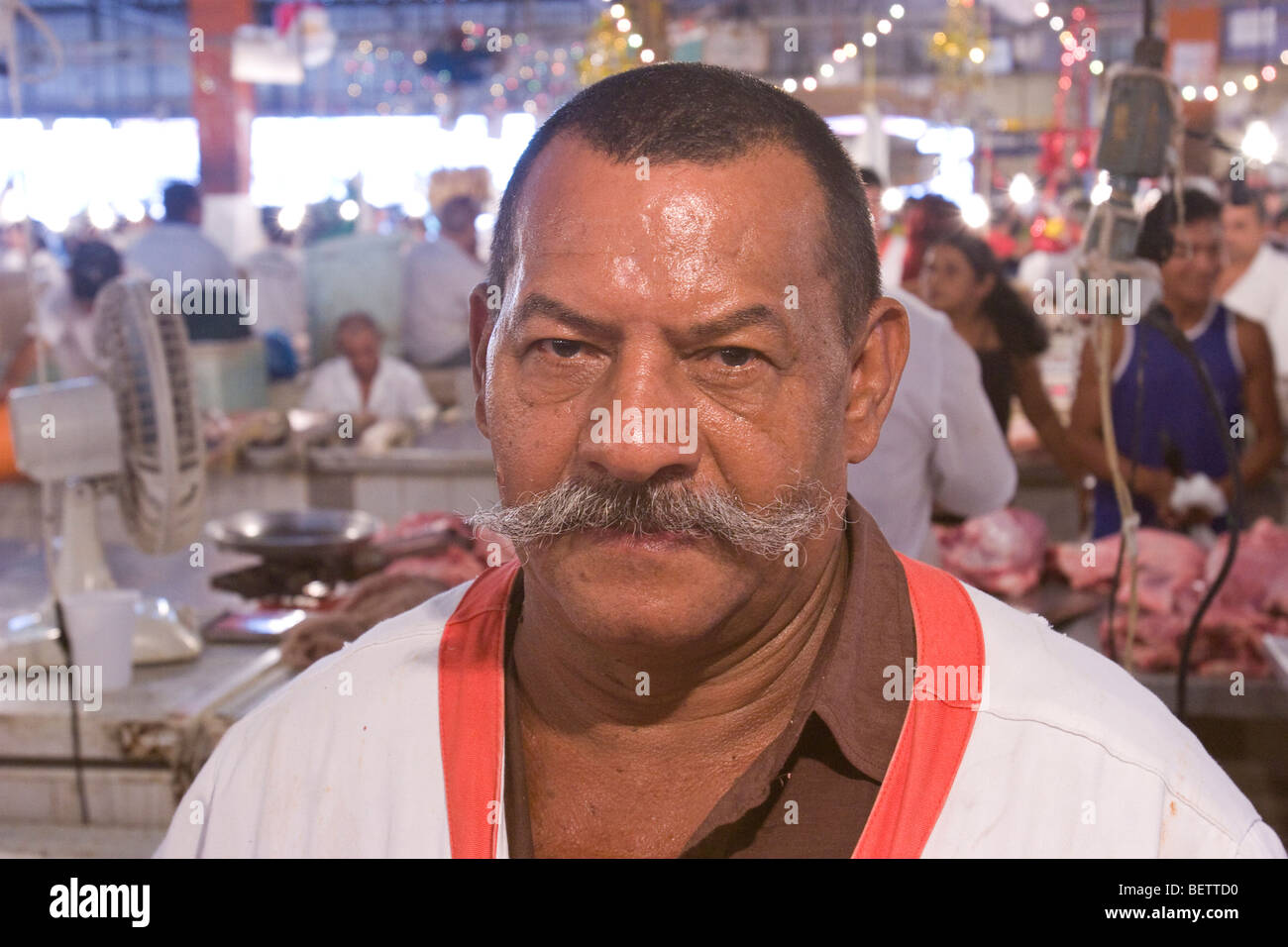 a butcher works at a busy market in the Amazon in Brazil Stock Photo ...