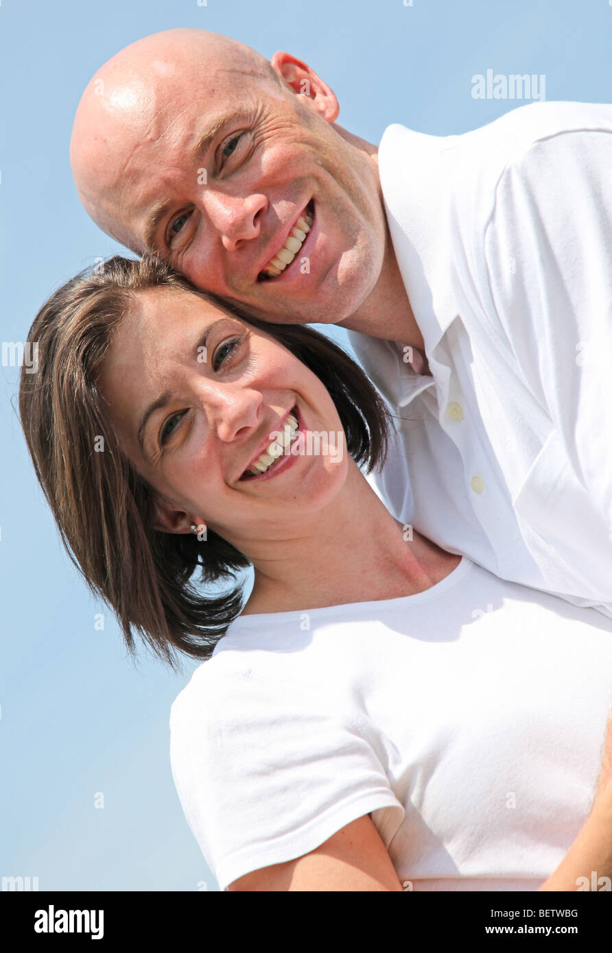 Happy good looking couple outdoor portrait Stock Photo - Alamy