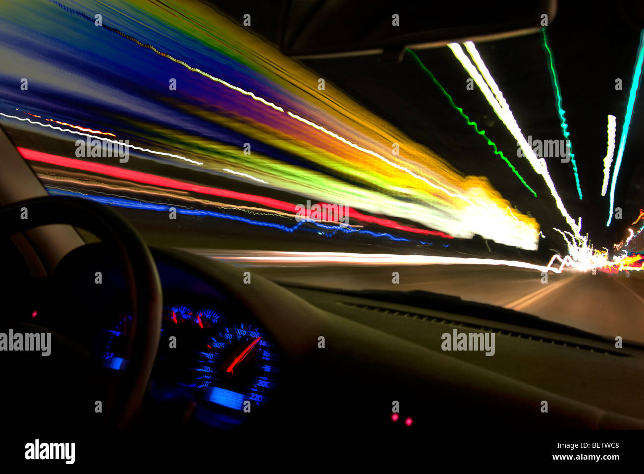 Speeding at Night Driving and Blurring Lights Stock Photo - Alamy
