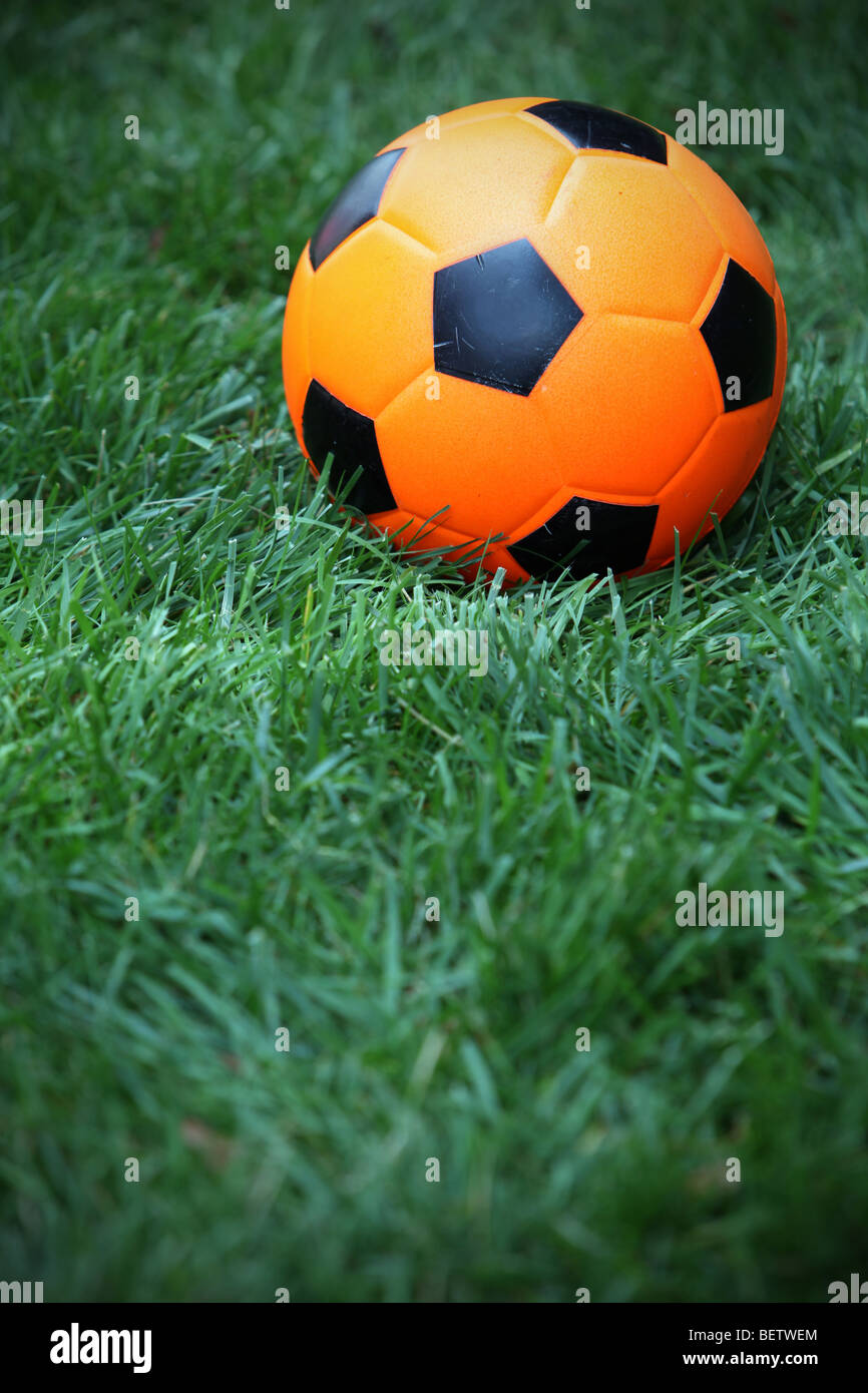 One orange football Stock Photo - Alamy