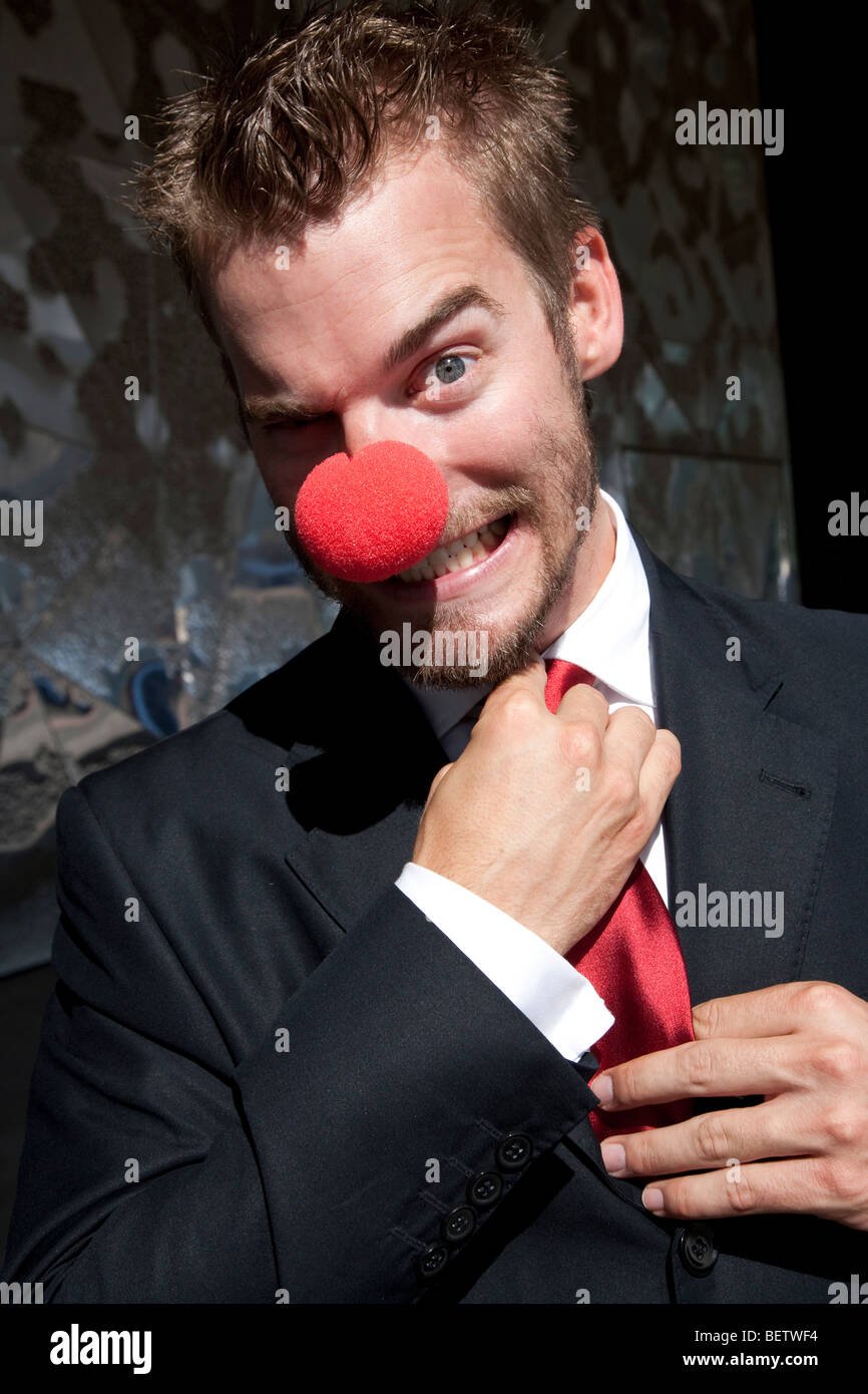 Businessman clowning around Stock Photo - Alamy