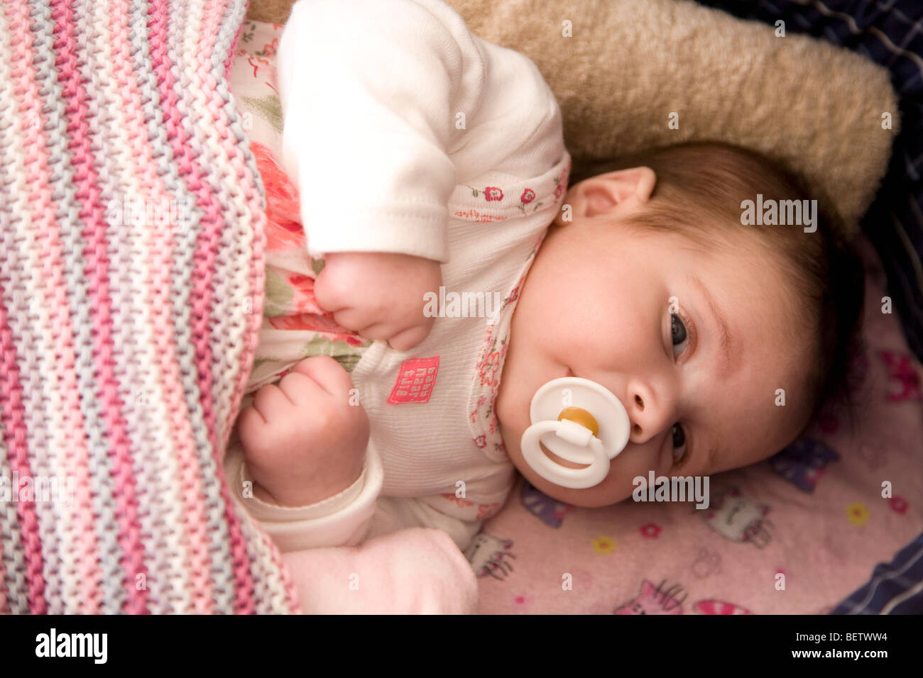 Baby In her cot Stock Photo - Alamy