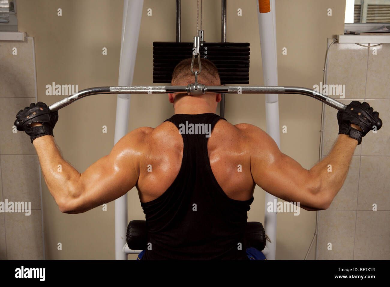 Man makes exercises for increase in force of muscles Stock Photo - Alamy