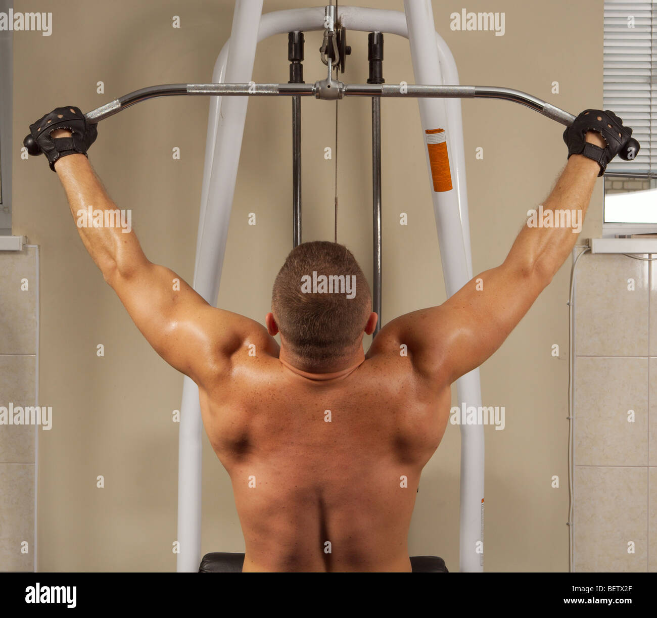 Man makes exercises for increase in force of muscles Stock Photo - Alamy