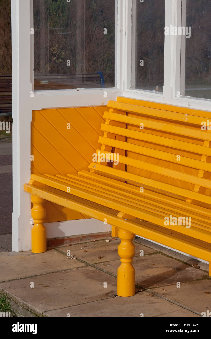 Yellow bench in bright sunshine Stock Photo - Alamy