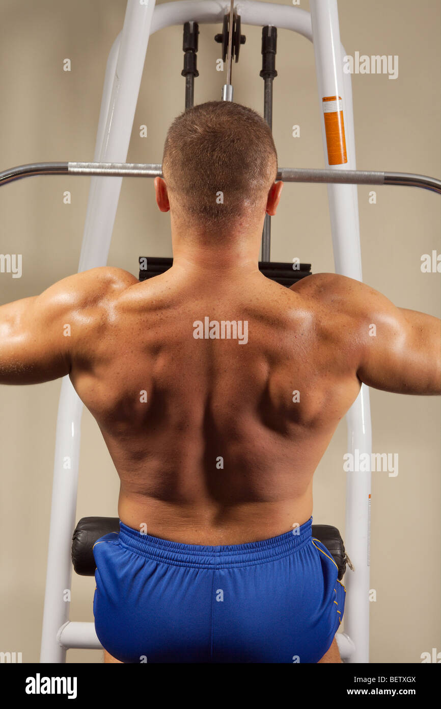 Man makes exercises for increase in force of muscles Stock Photo - Alamy