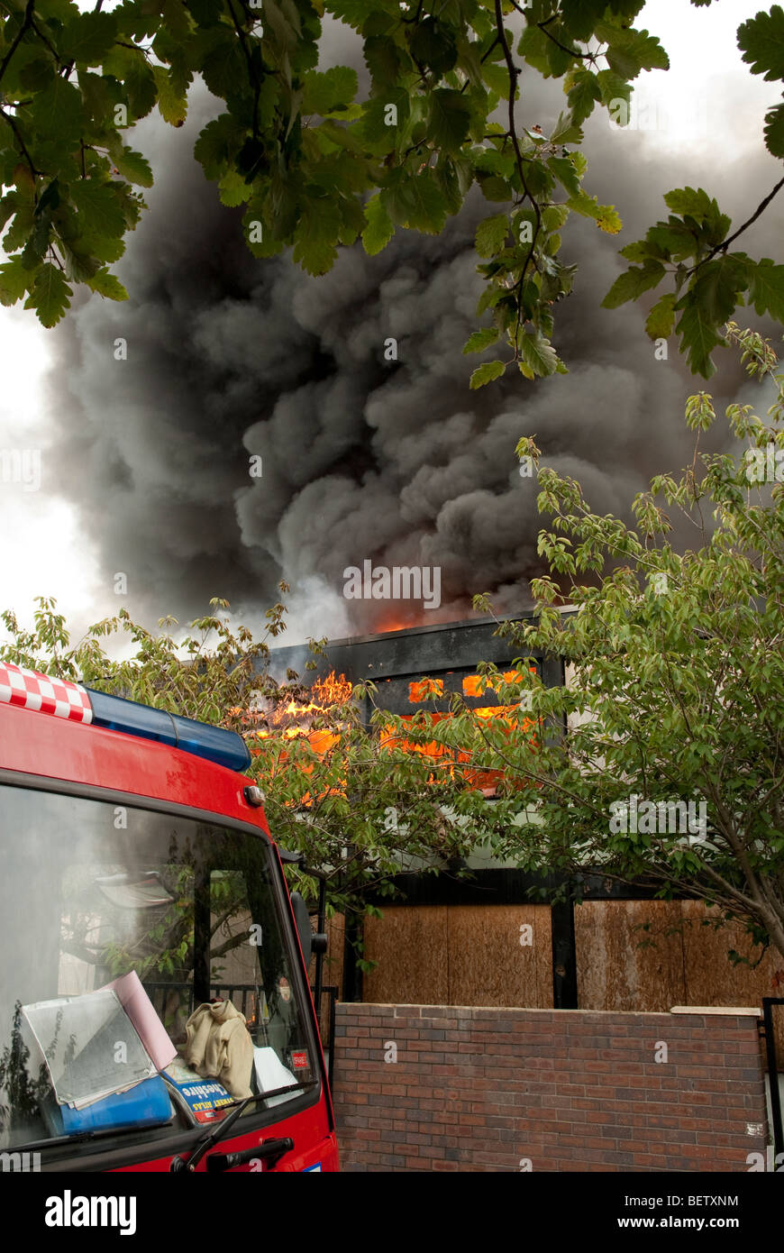 Factory office block on fire with flames and smoke from windows Stock ...