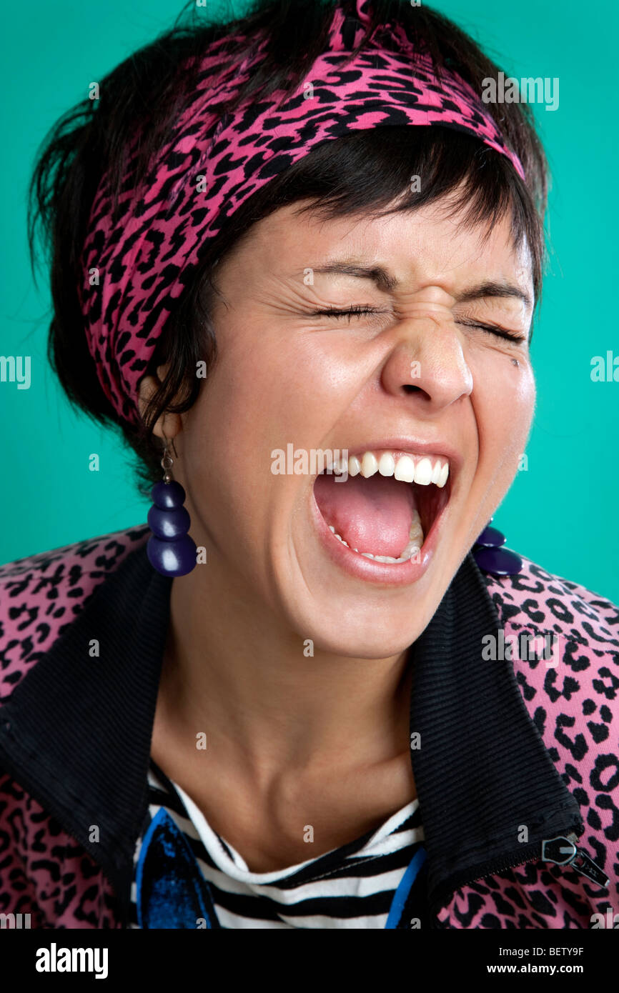Colorful woman with mouth wide open Stock Photo - Alamy