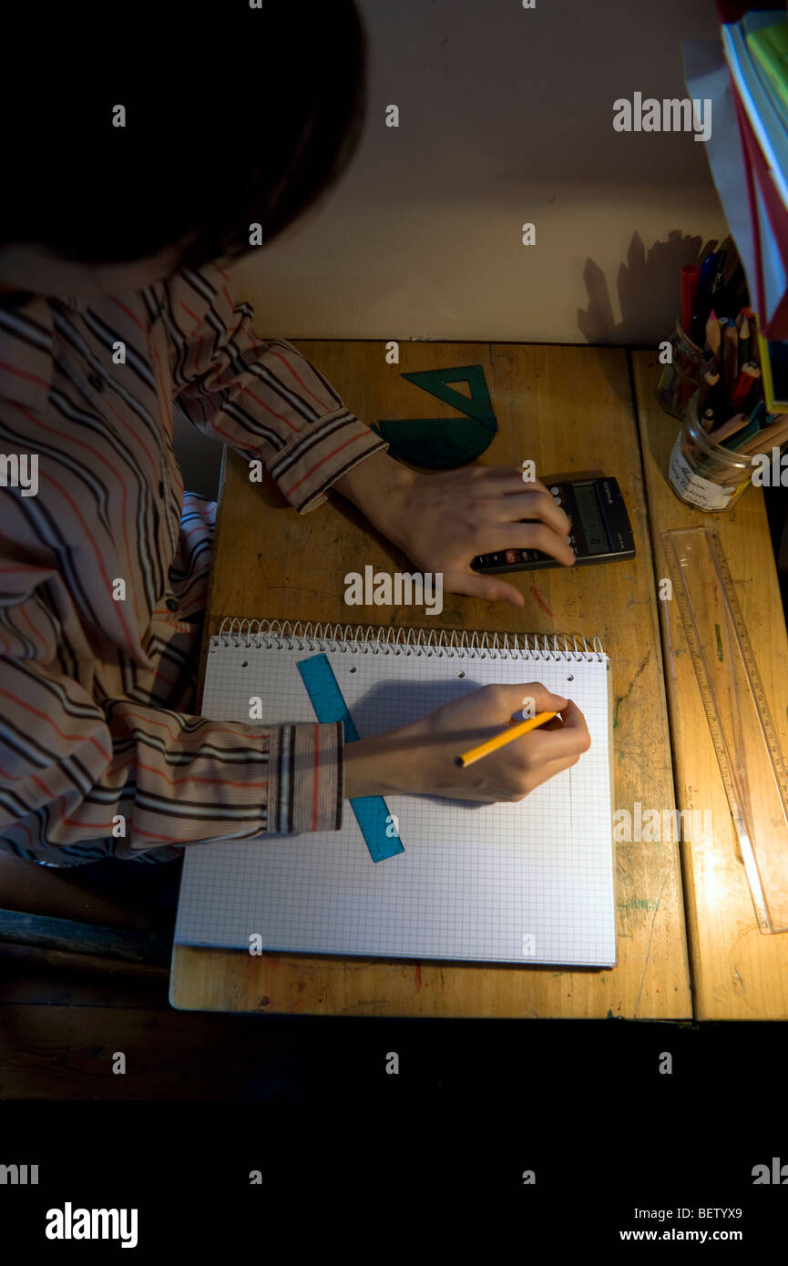 12 year old boy engaged in home learning /homework Stock Photo - Alamy