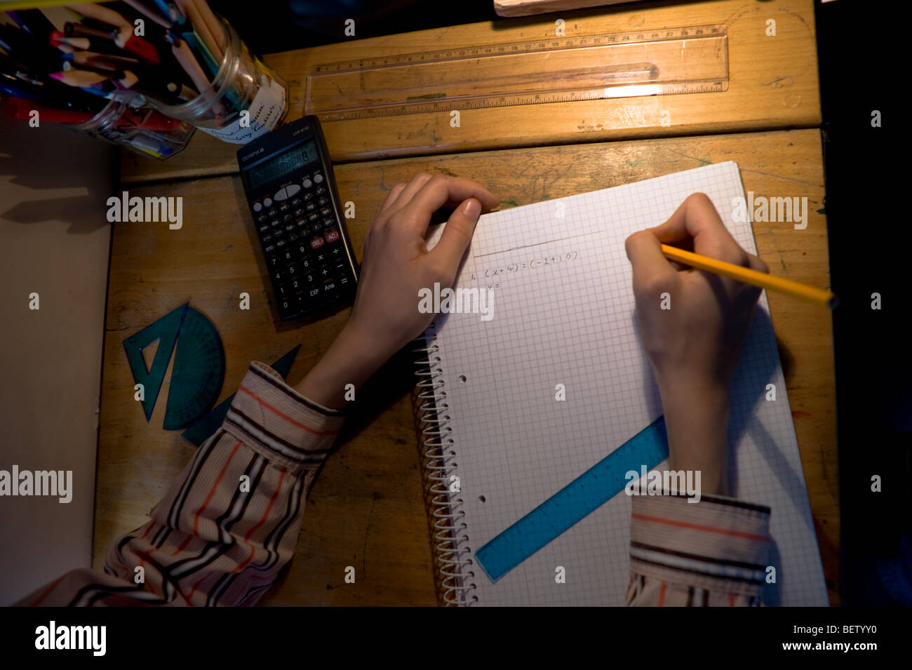 12 year old boy engaged in home learning /homework Stock Photo - Alamy