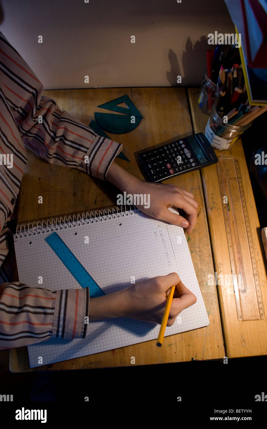 12 year old boy engaged in home learning /homework Stock Photo - Alamy