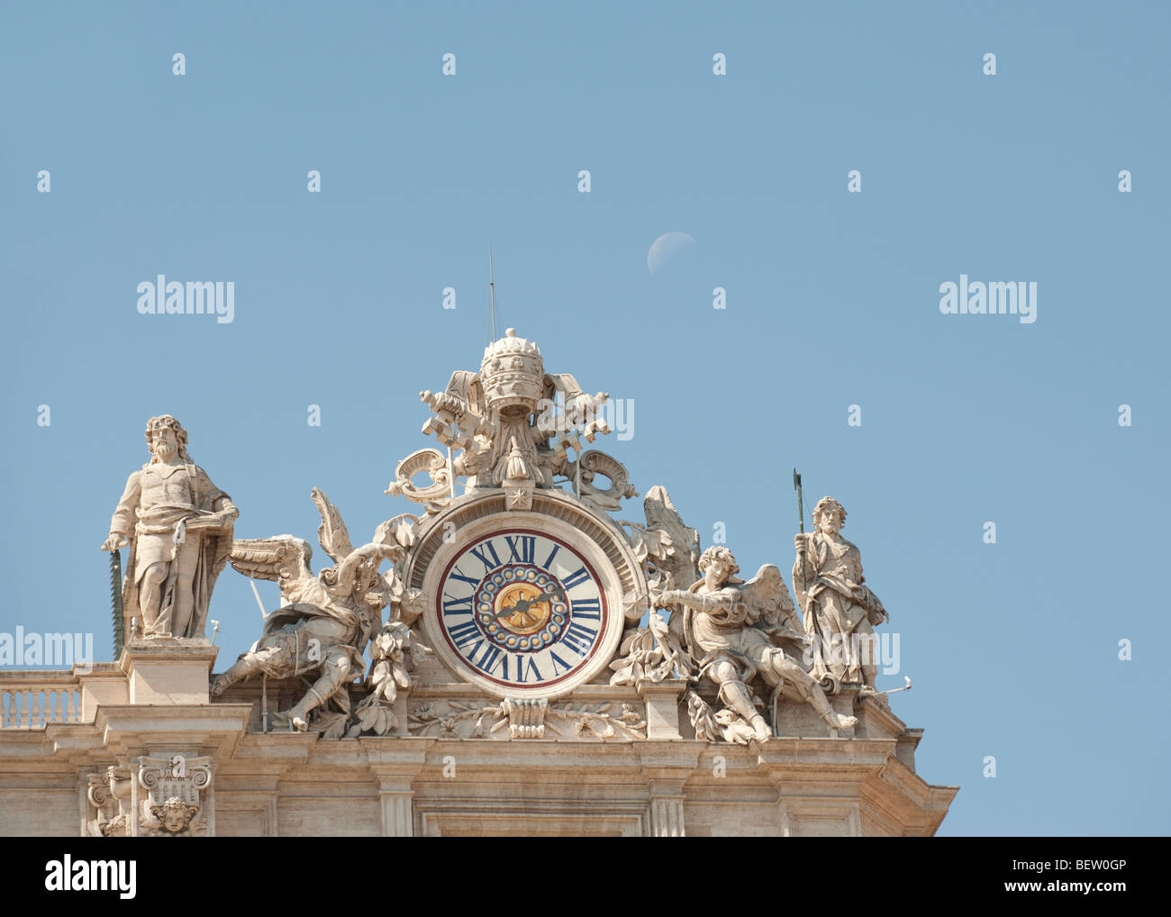 The ornate clock and statues on St Peter's Basilica, Vatican City, Rome ...