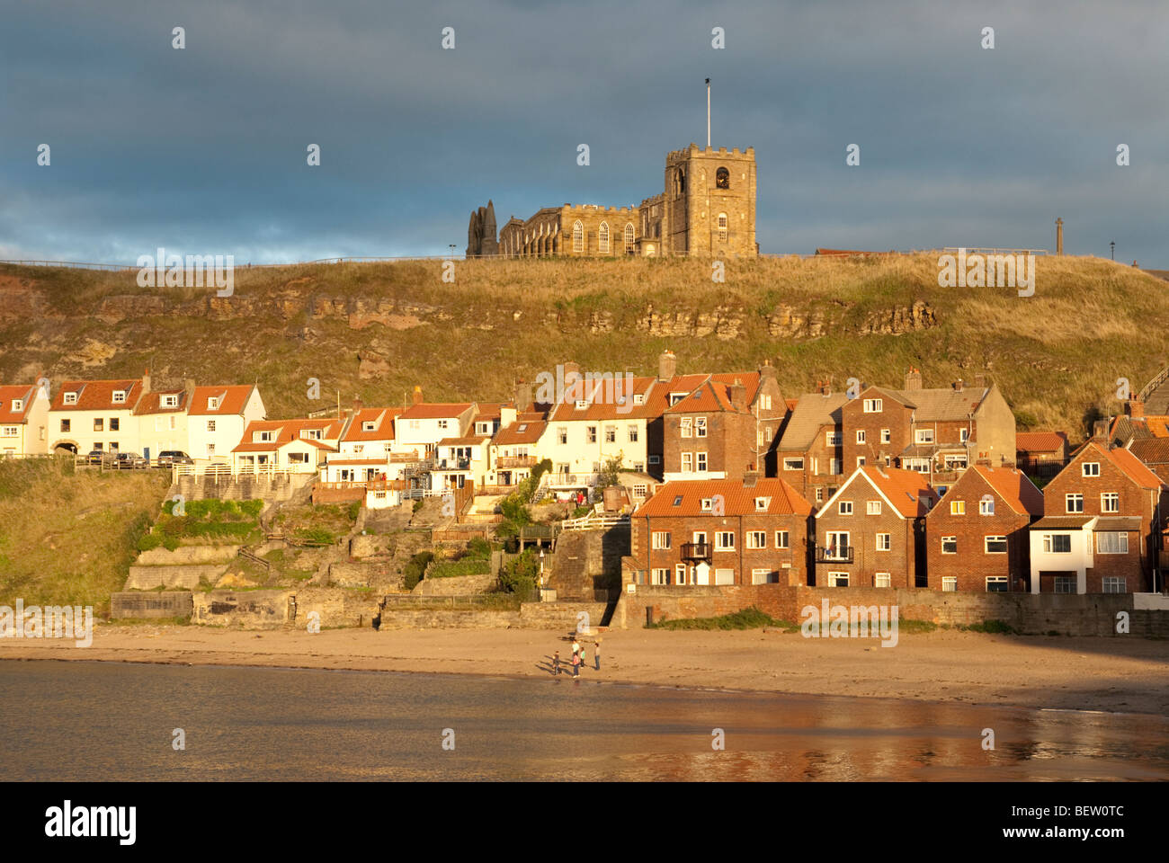 Evening light illuminates St Mary's Church on cliffs above Whitby ...