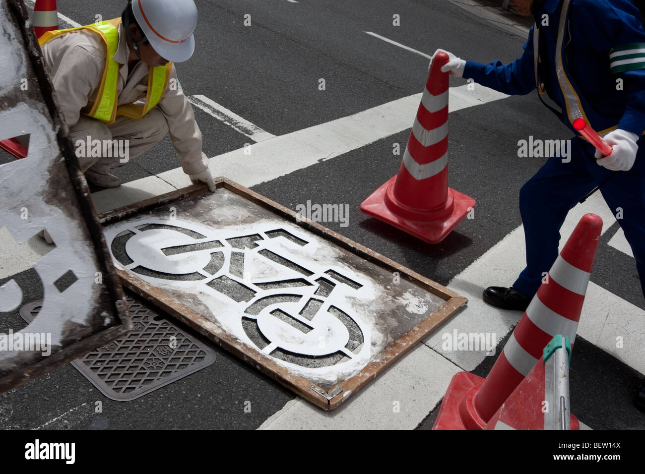 Painting bicycle lane road markings in Tokyo, Japan, on Tuesday 27th ...
