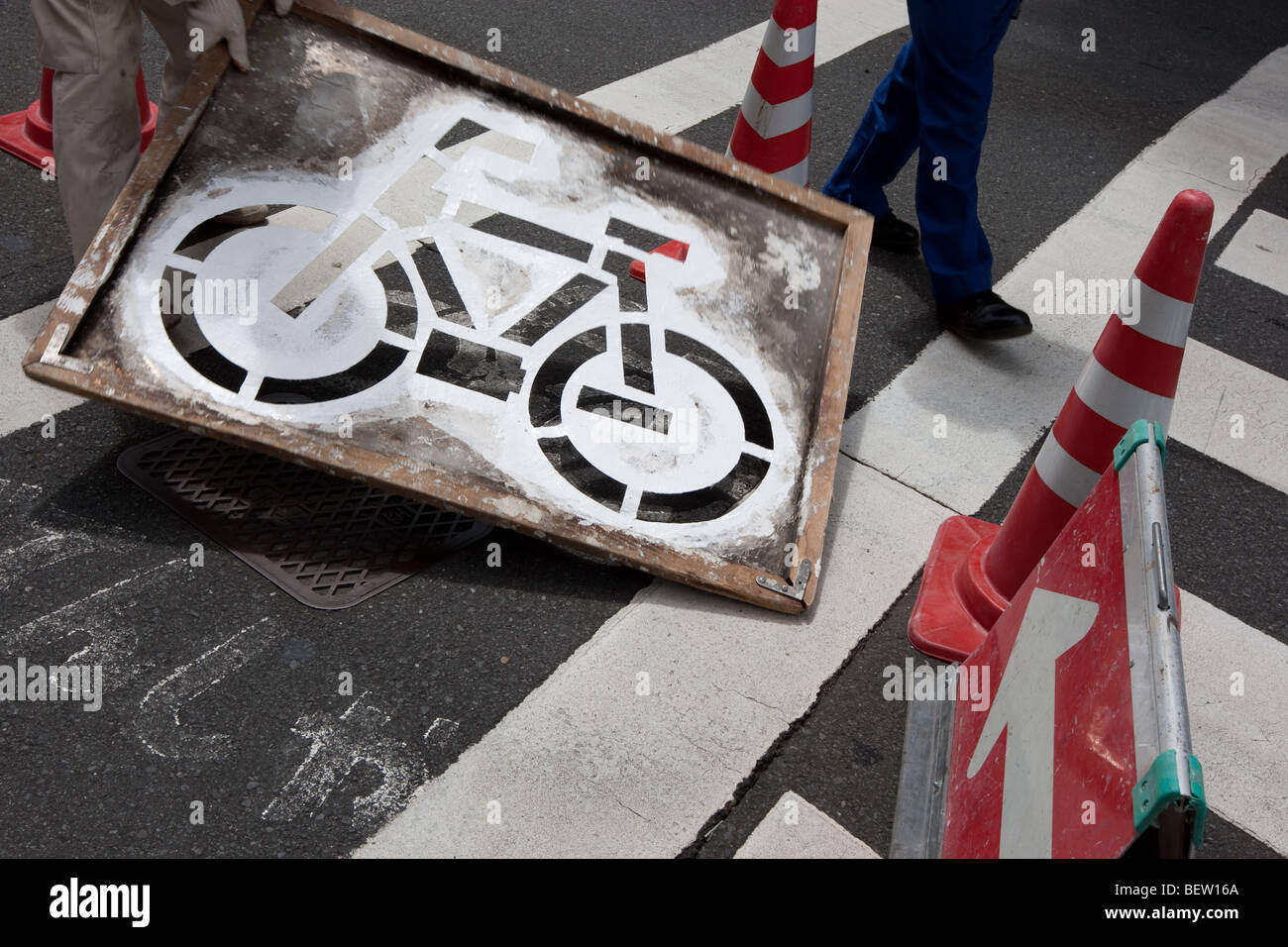 Painting bicycle lane road markings in Tokyo, Japan, on Tuesday 27th ...