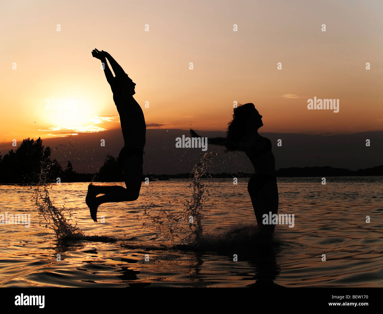 Girl bikini jumping water hi-res stock photography and images - Alamy