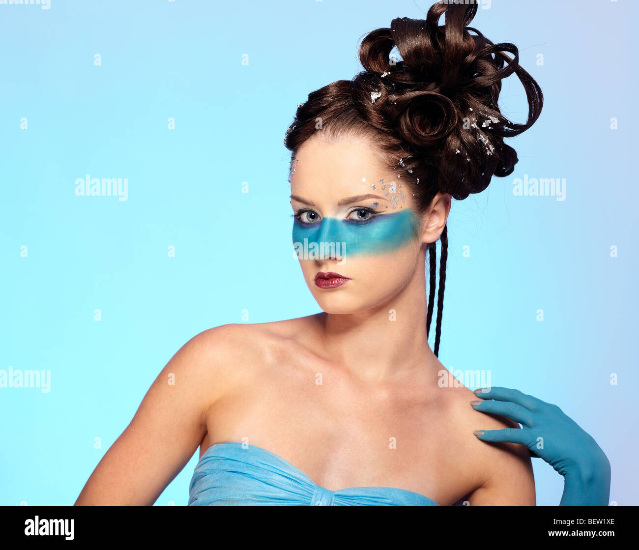 portrait of beautiful girl with blue stripe facial bodyart and fantasy ...